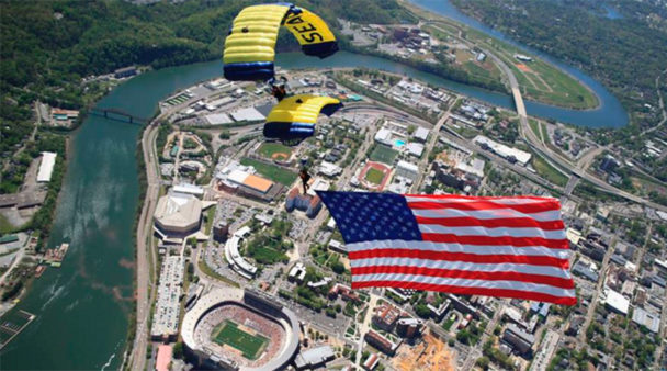 Navy Seals pulled of a spectacular parachute jumping on to a packed ...